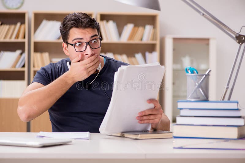 The Scared Student with Paperwork in Library Stock Photo - Image of ...