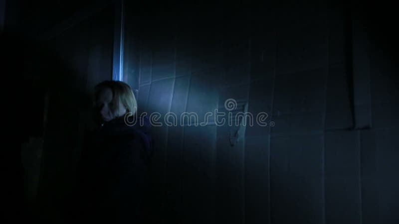 Scared Woman Hiding in a Corner of an Ancient Building. Stock Footage ...