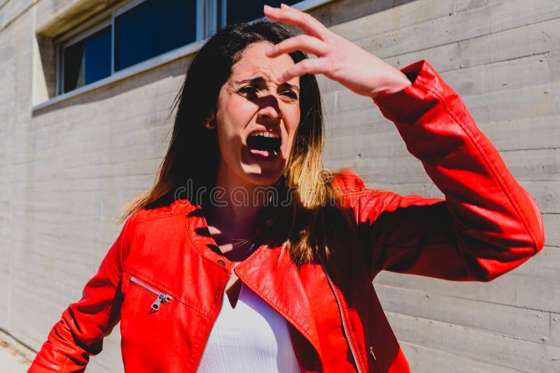 Scared Woman is Scared and Makes a Panic Face while Screaming for Help ...