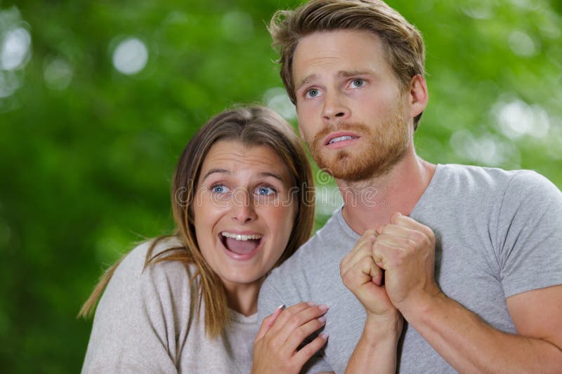 Scared Young Couple in Safari Suits in Jungle Stock Photo - Image of ...