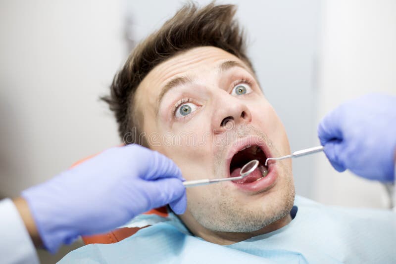 Scared Young Man at Dentist Office Stock Image - Image of worried ...