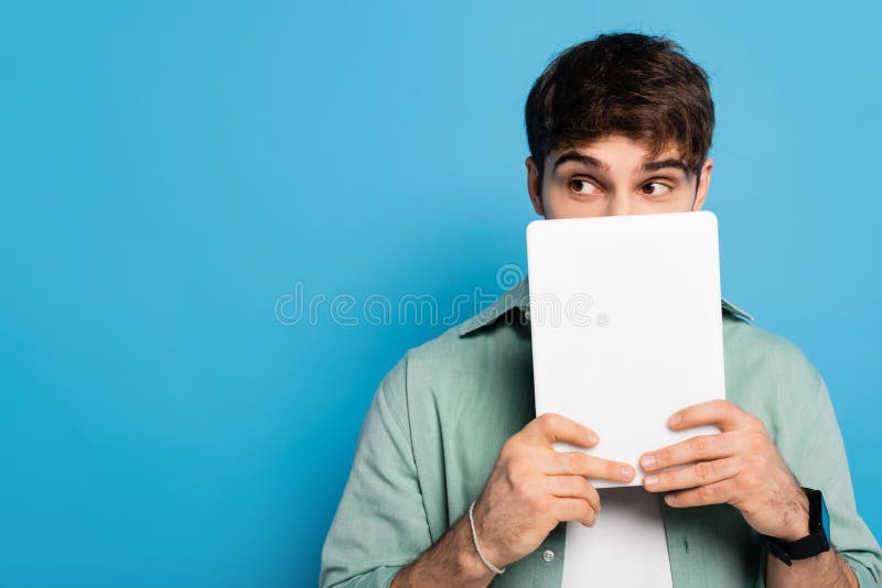 Young Man Obscuring Face with Digital Stock Image - Image of emotion ...
