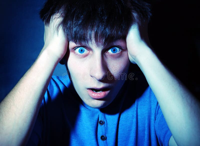 Scared Young Man stock photo. Image of indoor, amaze - 86001026
