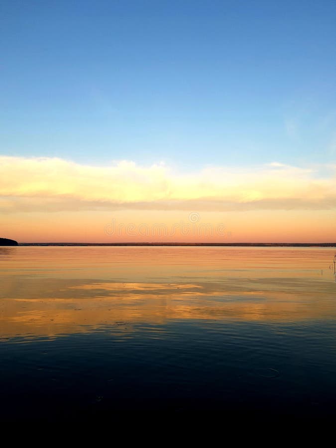 Scarlet Sunset Over the Mirror Water of the Lake Stock Image - Image of ...