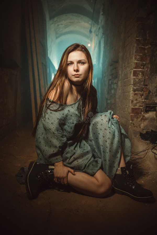 In a scary basement stock photo. Image of brunette, scary - 65677480