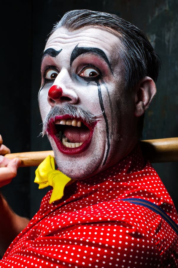 The Scary Clown and Baseball-bat on Dack Background. Halloween Concept ...