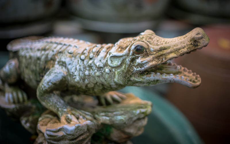 Scary Crocodile Sculpture with Red Eyes Stock Photo - Image of ...
