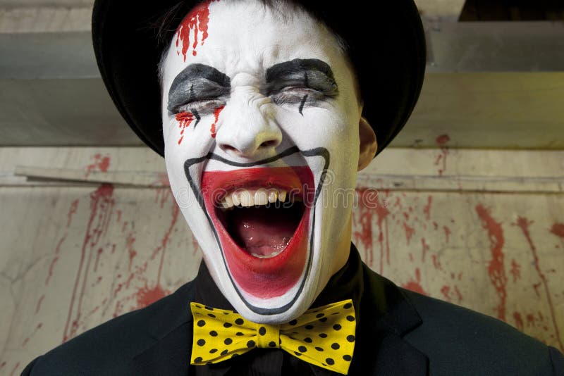 Scary Evil Clown Wearing a Bowler Hat on Wall Stock Photo - Image of ...
