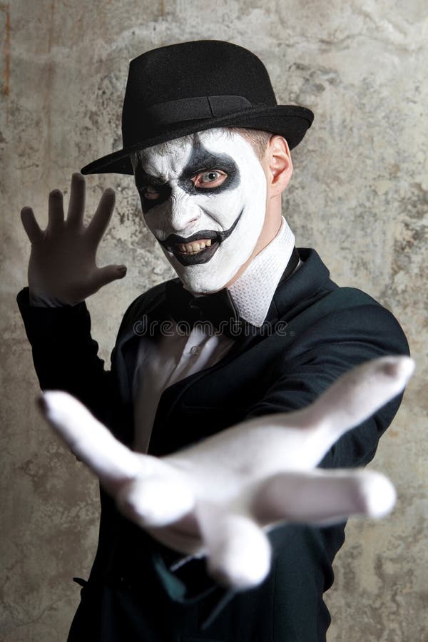 Scary Evil Clown Wearing a Bowler Hat on Wall Stock Photo - Image of ...