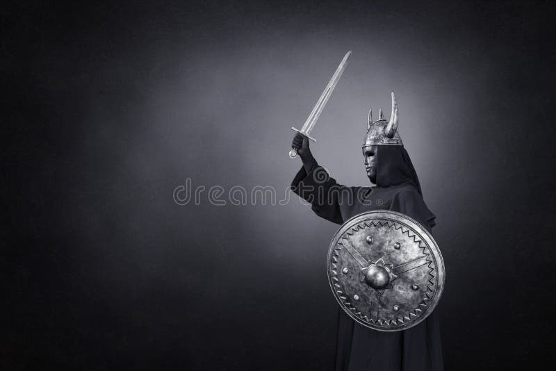 Scary Figure with Horned Helmet, Sword and Round Shield Stock Image ...
