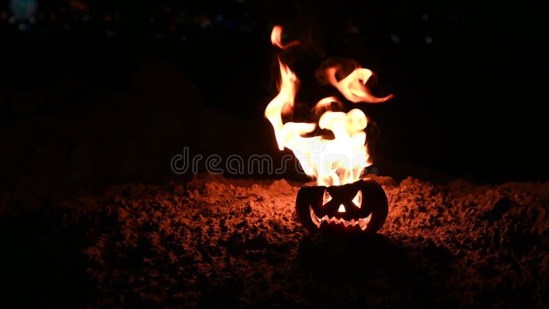 Scary Halloween Pumpkin is Spewing Fire Flame on Black Background. Jack ...
