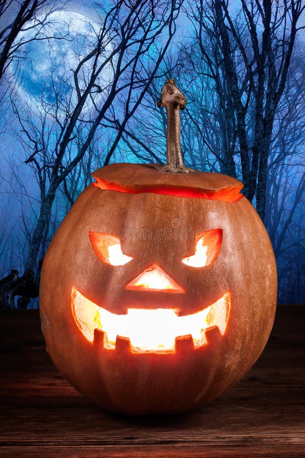 Scary Jack-o-lantern on Wood Stock Photo - Image of night, halloween ...