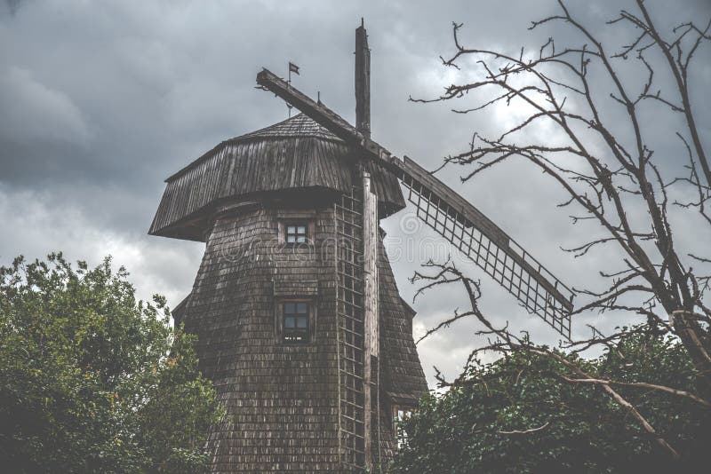 Windmill with Dead Tree Limbs Stock Photo - Image of country, eerie ...