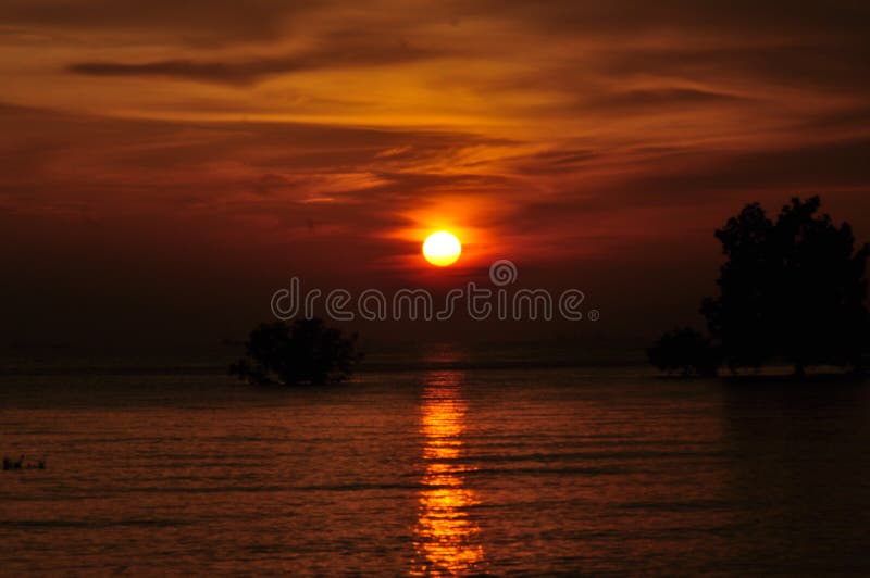 Scary sun at sunset time. stock image. Image of timeevening - 262267459