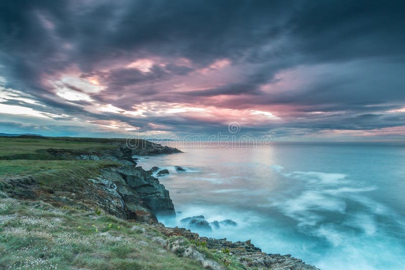 Scary Sunset, with Red Sky and Clouds, after Storm. Power Pylons and ...
