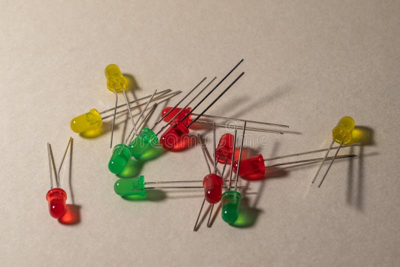 Colorful LED Diodes Scattered on a Plain Background, Depicting Various ...