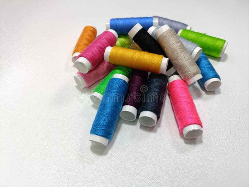 Scattered Colorful Sewing Thread Spools on White Background Stock Image ...