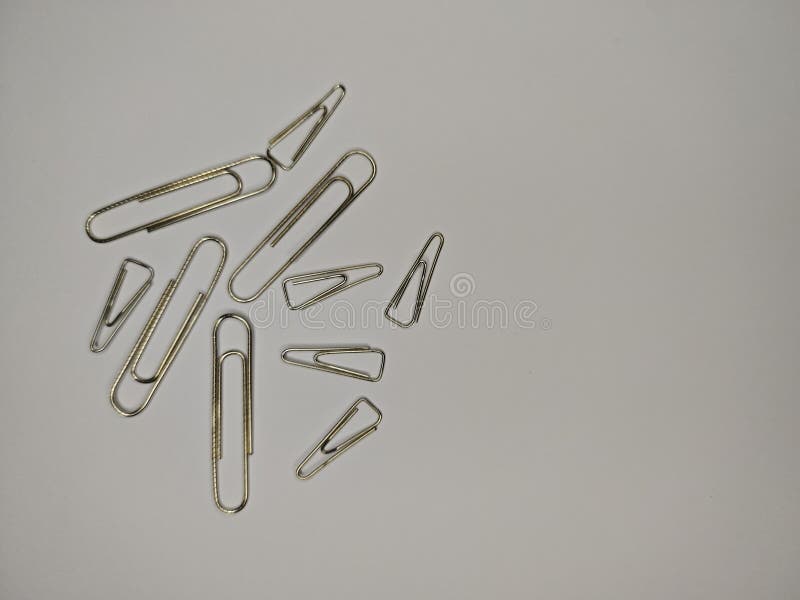 A Scattered Cluster of Paper Clips, Showcasing Their Various Shapes and ...