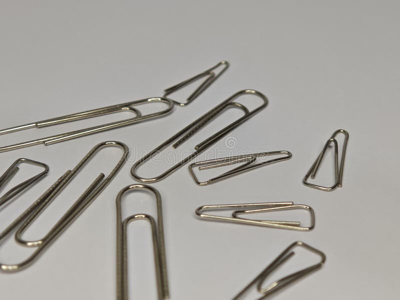 A Scattered Cluster of Paper Clips, Showcasing Their Various Shapes and ...