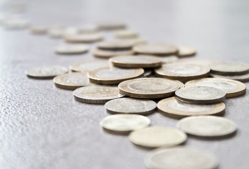 Scattered Coins on Grey Table. Stock Photo - Image of cents, gold ...