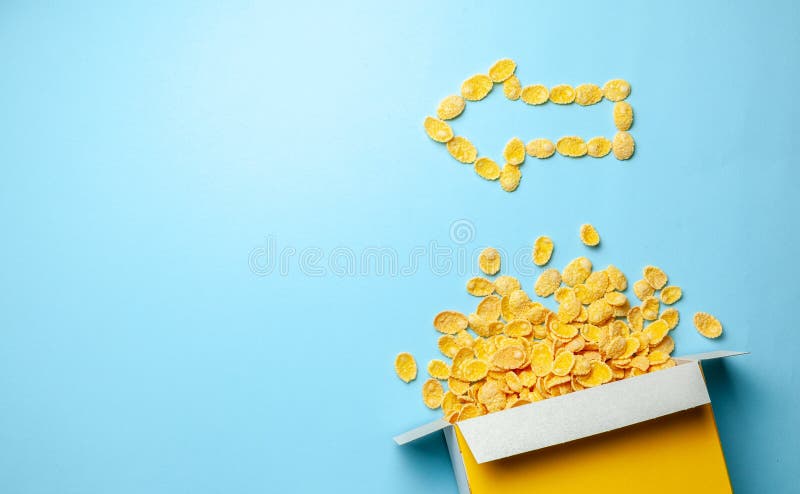 Scattered Cornflakes Out of the Box in the Shape of an Arrow To the ...