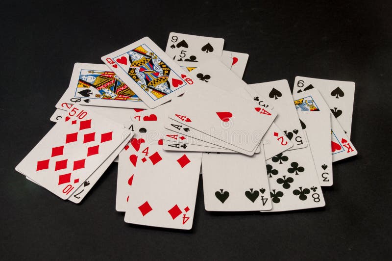 Scattered Deck of Cards on a Black Background Stock Image - Image of ...