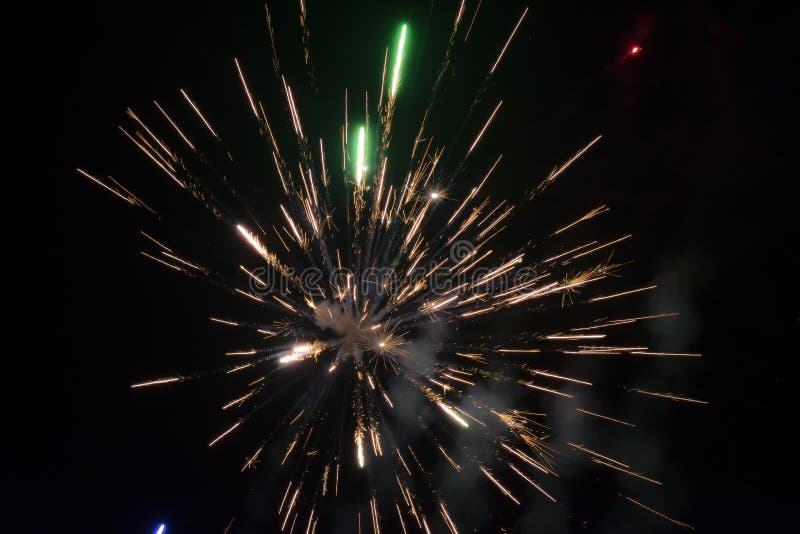 Scattered Exploding Firework at Night Stock Photo - Image of greens ...