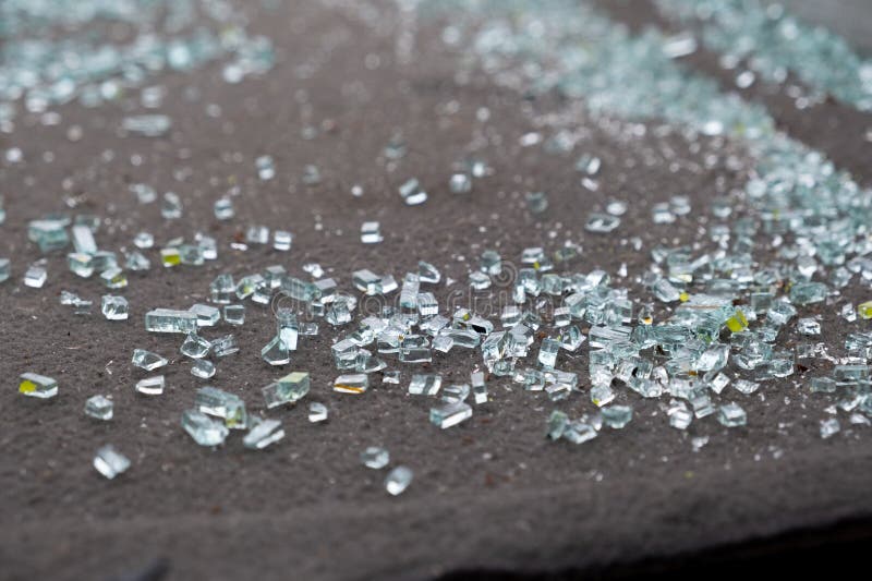 Scattered Fragments of Shattered Glass Resting on a Dark Surface ...