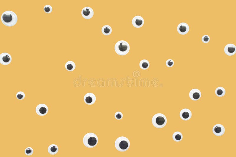 Scattered Googly Eyes on Yellow Background with Playful and Creative ...