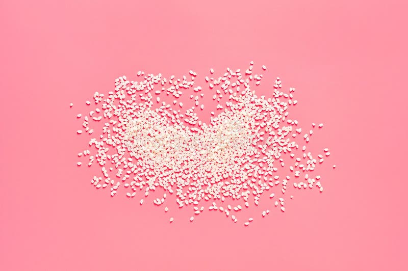 Scattered Grain of Rice on Pink Background Stock Photo - Image of ...