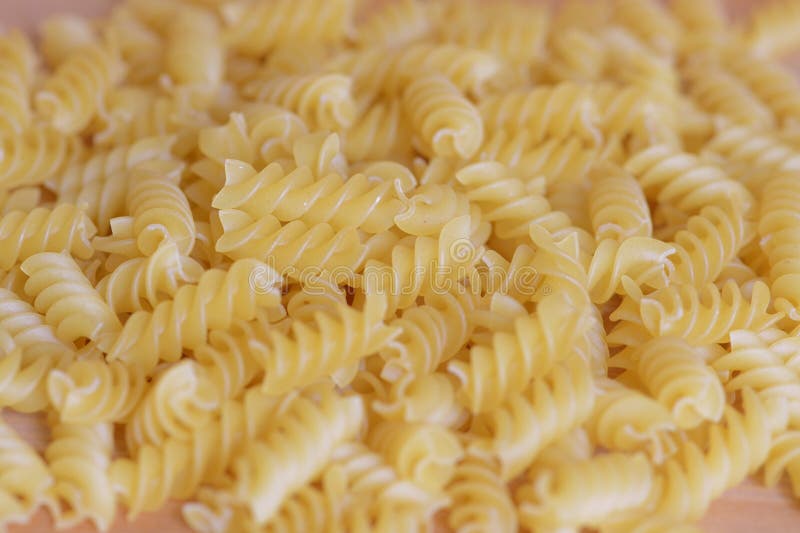 Scattered Macaroni on a Wooden Surface Close-up. Food Background Stock ...