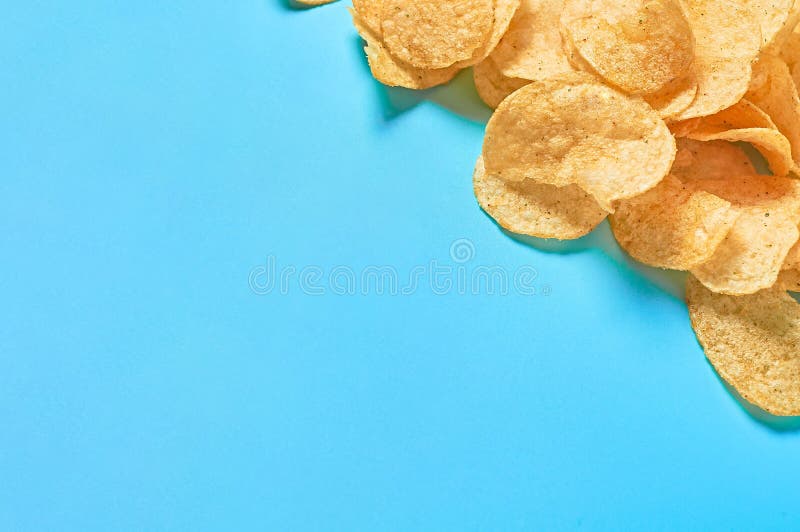Scattered Many Fried Potato Chips on Blue Background Stock Photo ...