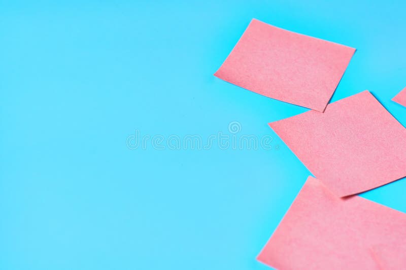 Scattered Many Pink Square Blank Paper Stickers on Blue Background ...