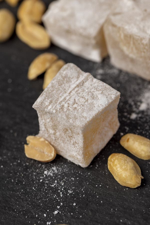 Scattered Oriental Sweets Turkish Delight with Peanuts on a Black Slate ...