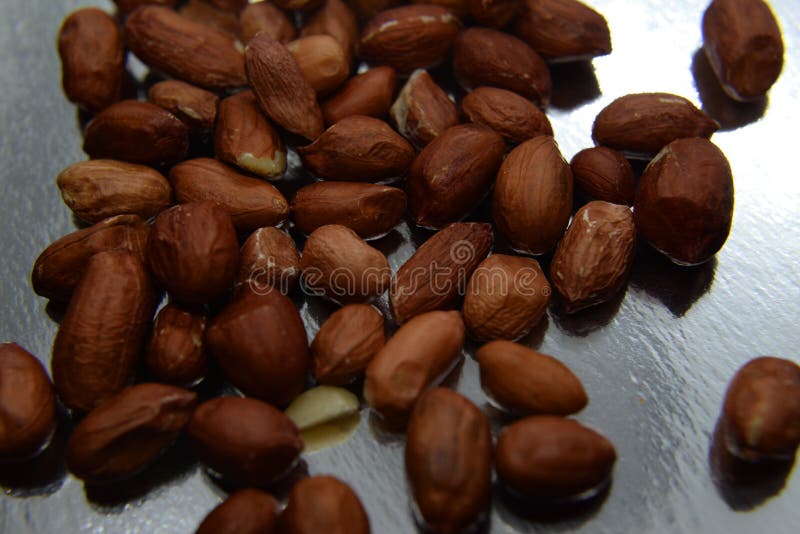 Scattered Peanut Nuts on a Silver Background Stock Photo - Image of ...