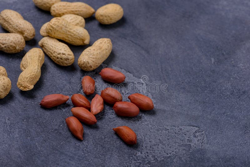 Scattered Peanuts on Dark Background Stock Photo - Image of healthy ...