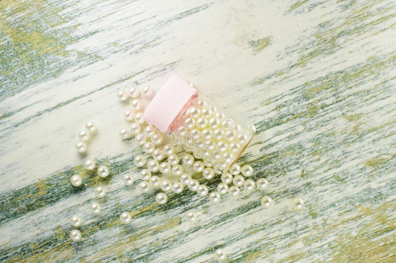 Scattered Pearl Beads and Jars Filled with Pearls. Stock Image - Image ...