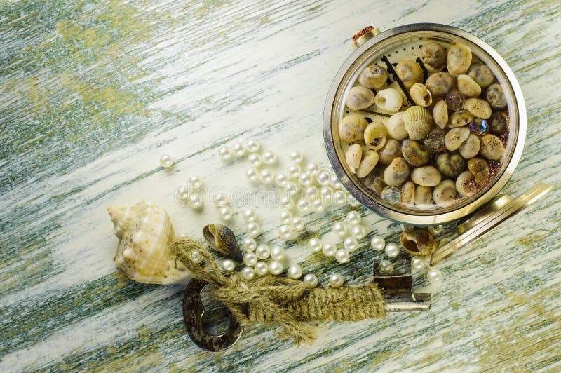 Scattered Pearls and Converted Clock with Seashells and Old Key. Stock ...