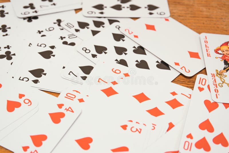 Scattered Playing Cards on Wooden Table Stock Photo - Image of deck ...