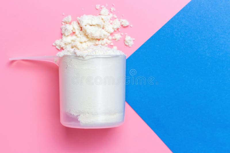 Scattered Protein and Scoop on Blue and Pink Background, Top View ...