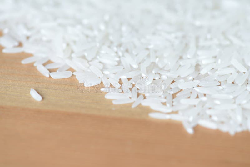 Scattered Rice Grains on the Wooden Surface Stock Photo - Image of ...