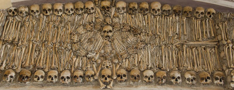 Human Skulls and Bones in a Wall Editorial Photography - Image of ...