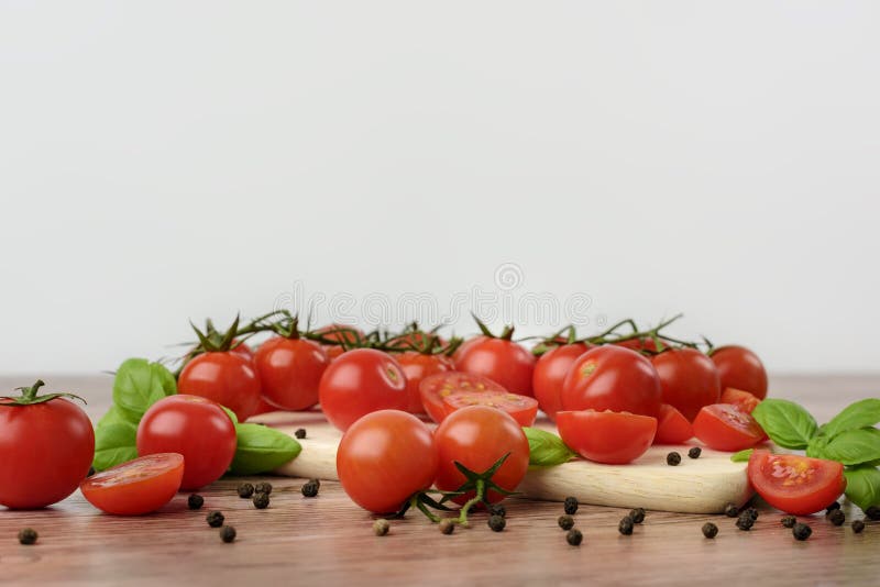 Scattered Tomatoes on the Wooden Table. Stock Image - Image of green ...