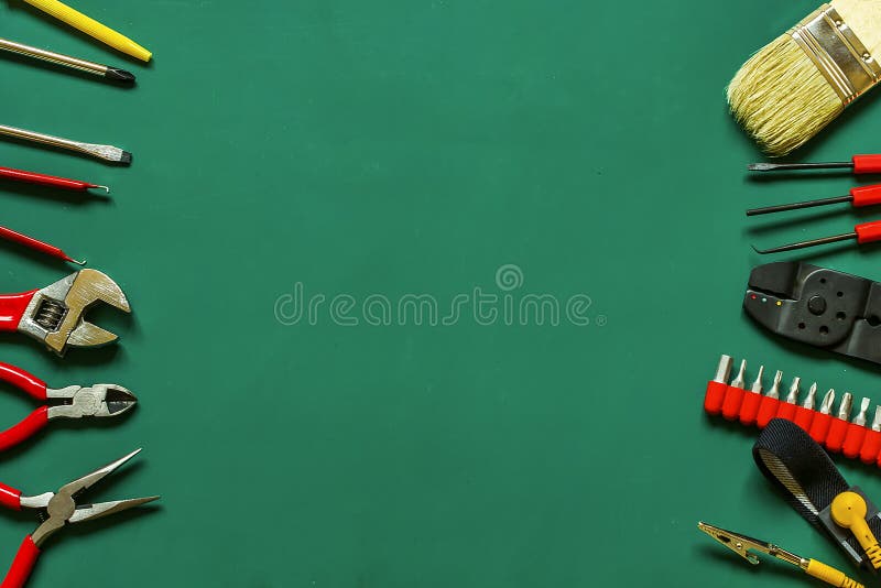 Scattered Tools for Electronics Repair on a Green Background Stock ...