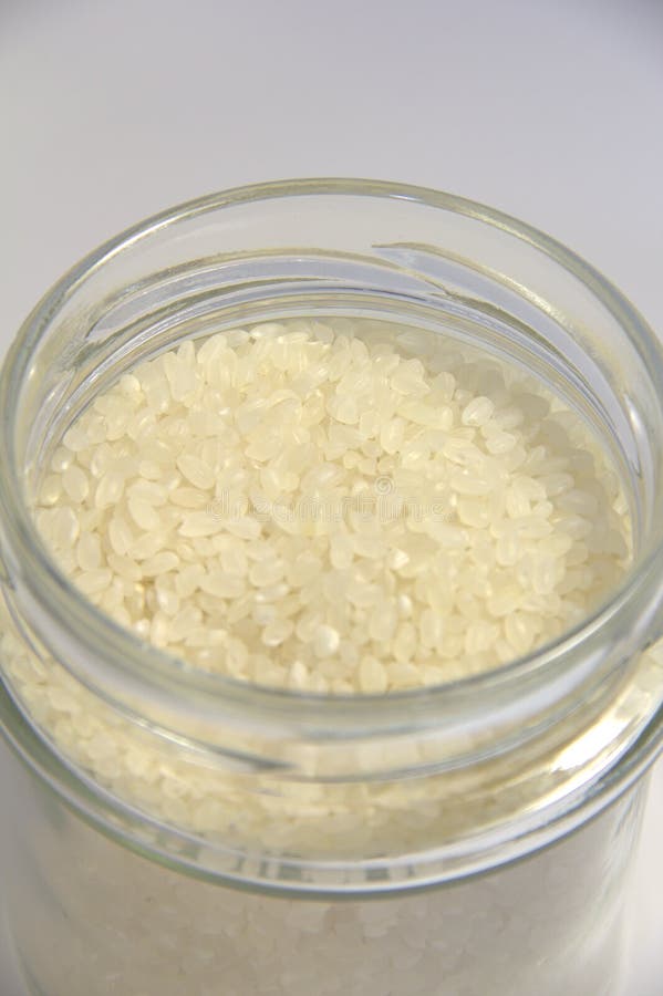 Scattered White Rice in Transparent Jars. on a White Background ...