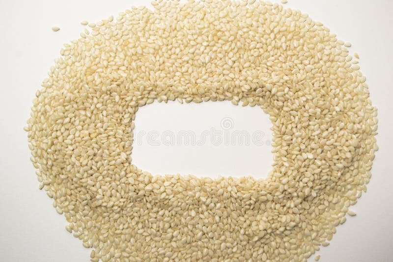 Scattered, White Sesame Seeds on a White Background. Sesamum Stock ...