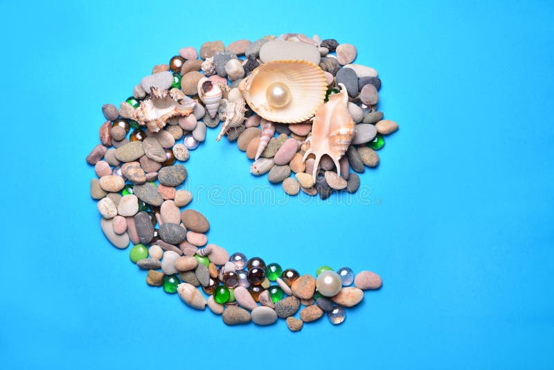 Sea Stones and Shells on a Blue Background Stock Photo - Image of ...
