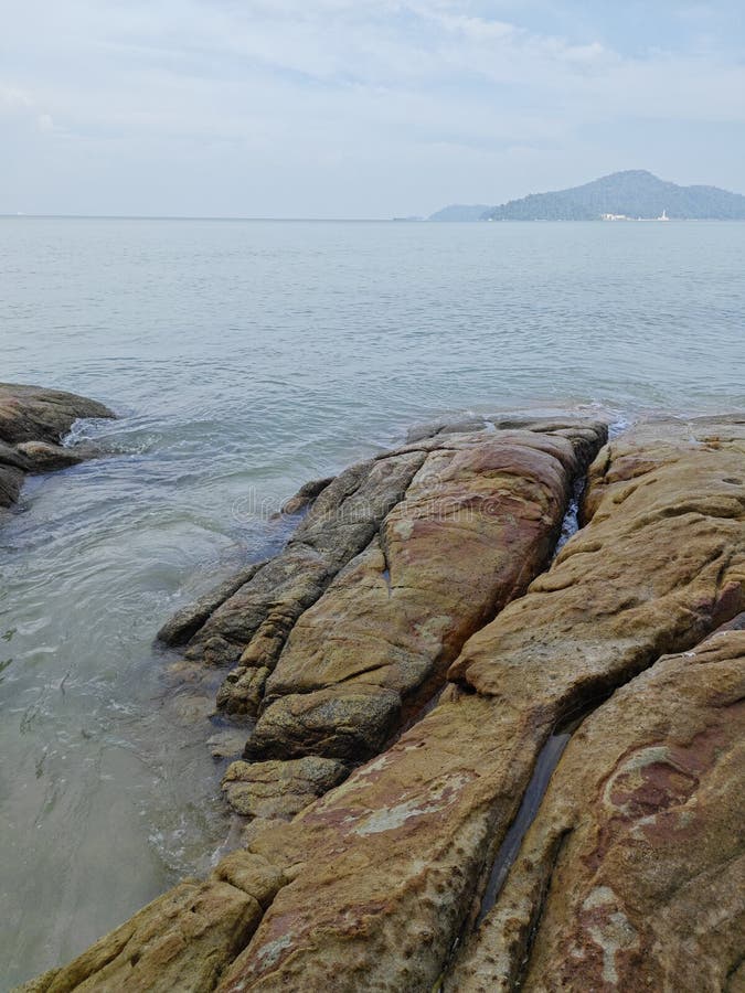 Scene of Boulder Laying Along the Sandy Beach Stock Image - Image of ...