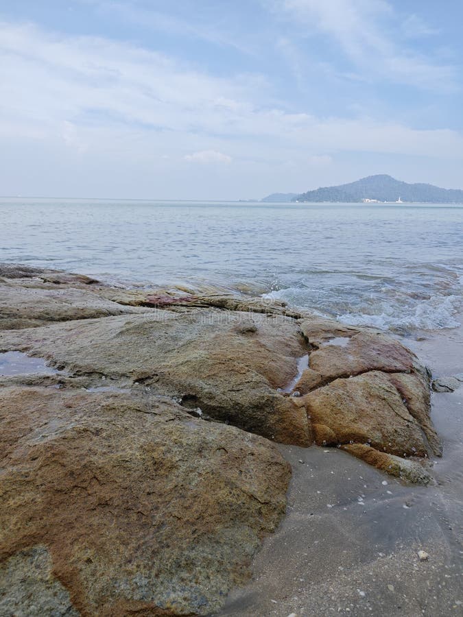 Scene of Boulder Laying Along the Sandy Beach Stock Photo - Image of ...