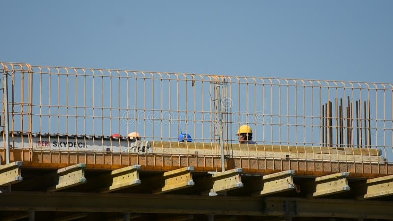 Scene of Crane at Building Construction Site with Workers on Buliding ...